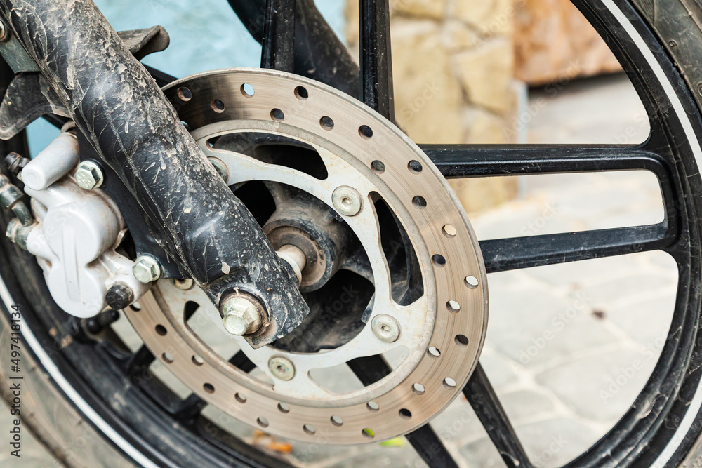 The front wheel of a powerful sports motorcycle, with a brake system ...