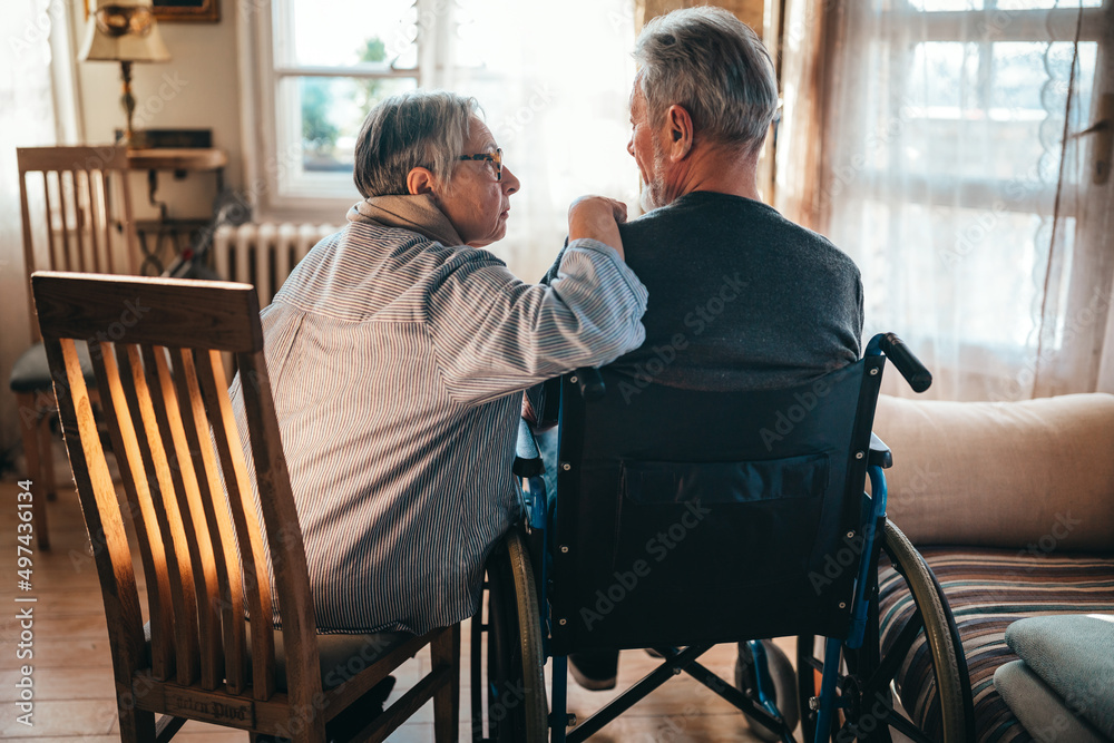 Couple of two sad old people in love sitting together at home. Senior ...