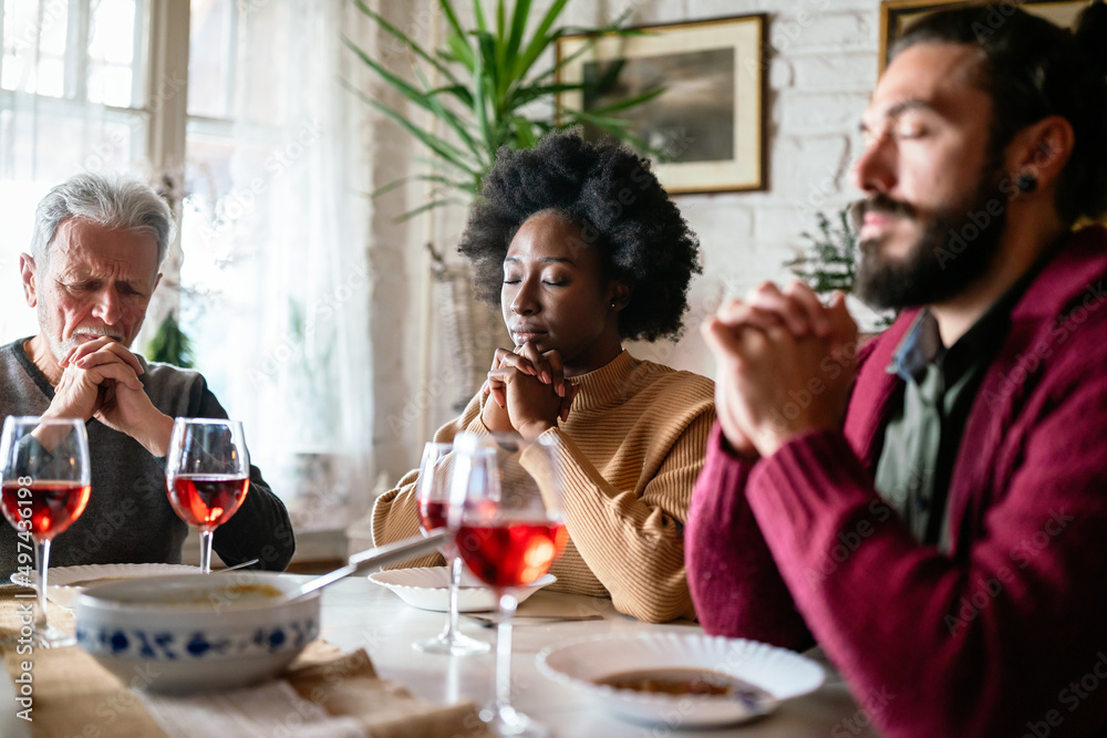 Family and religious concept. Group of multiethnic people with food ...