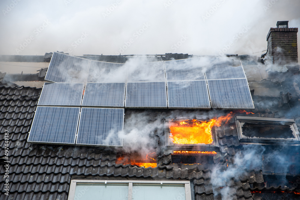 burning solar panels on roof Stock Photo | Adobe Stock