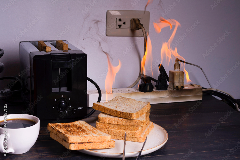 Toasting bread causes a short circuit, a flame, a fire, an old and poor ...