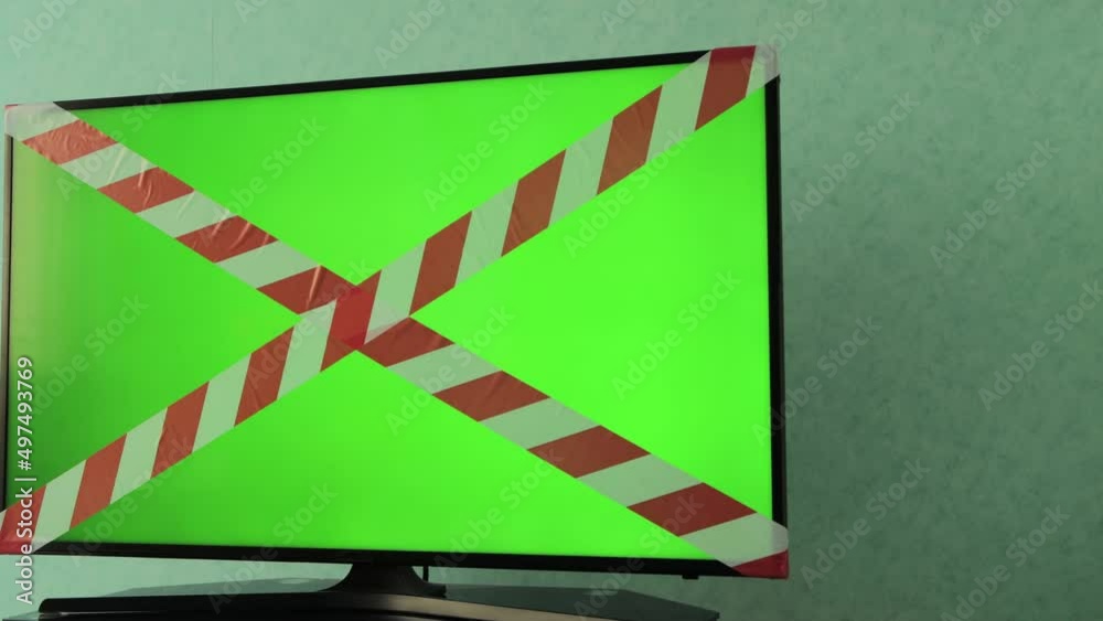 TV screen with forbidden tape and green chroma key screen. The concept ...