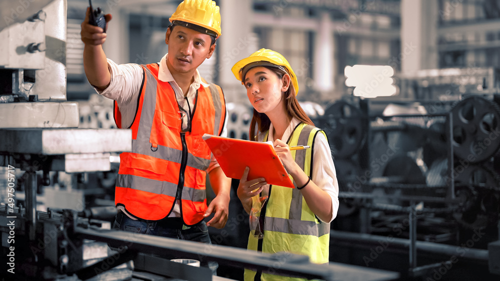 Foto de Engineer wearing safety vest controlling machine working ...