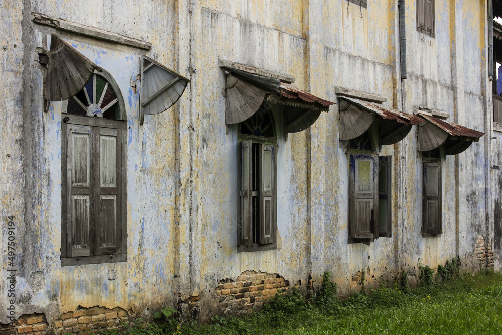 Vintage wooden windows with awnings of a heritage house in the old town ...