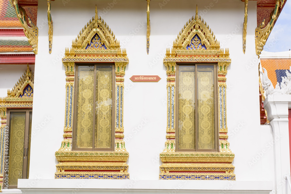 Ancient golden temple windows on a white wall in Wat Benchamabophit in ...