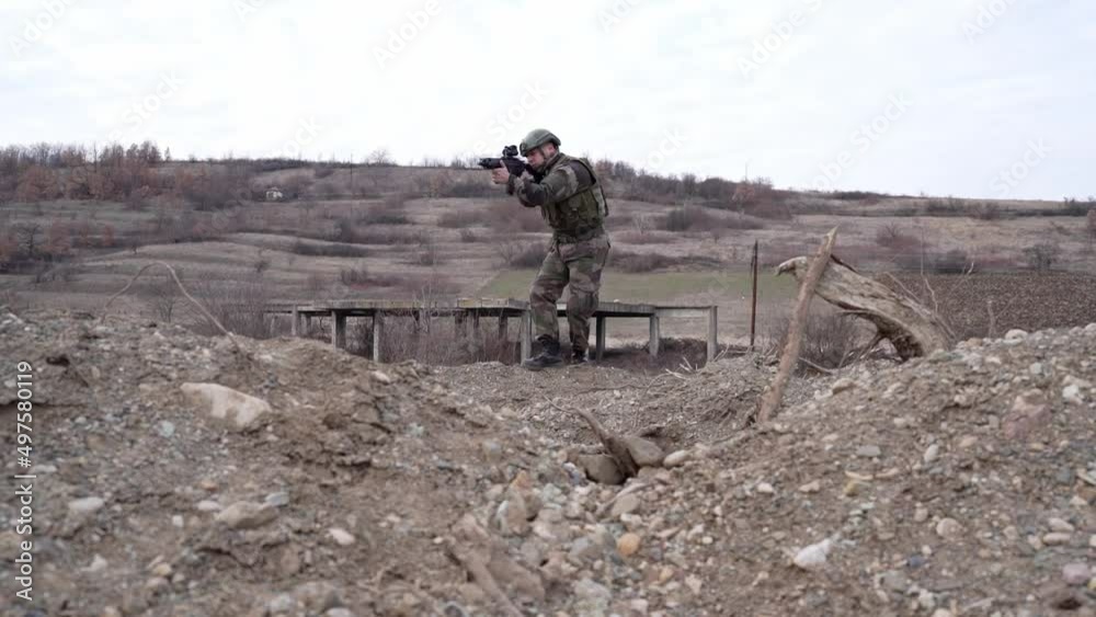 one man front view soldier in camouflage uniform armed with rifle ready ...
