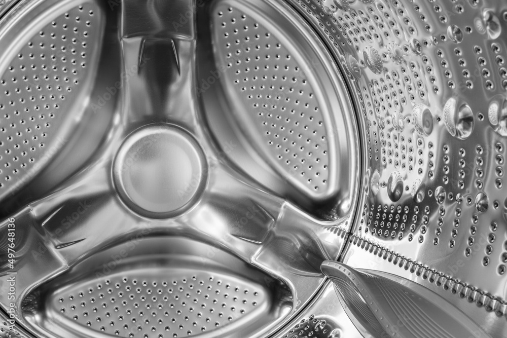 The inside of the washing machine is shining. Stock Photo | Adobe Stock