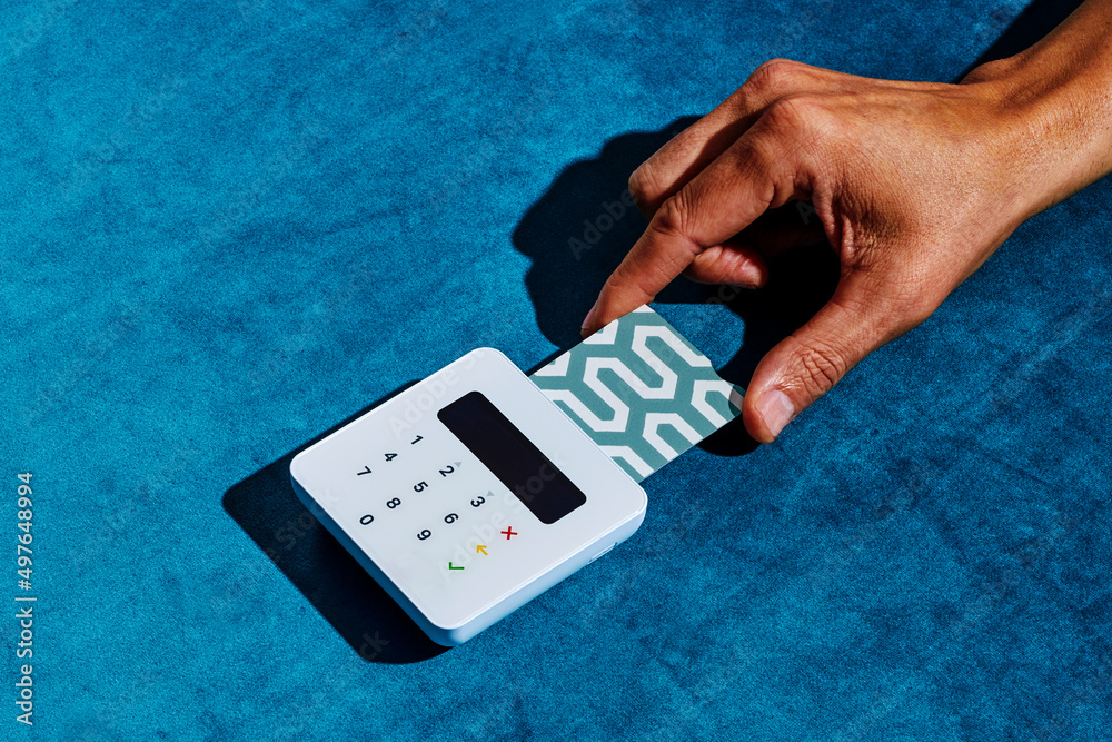 inserting a credit card into a wireless payment terminal Stock Photo ...