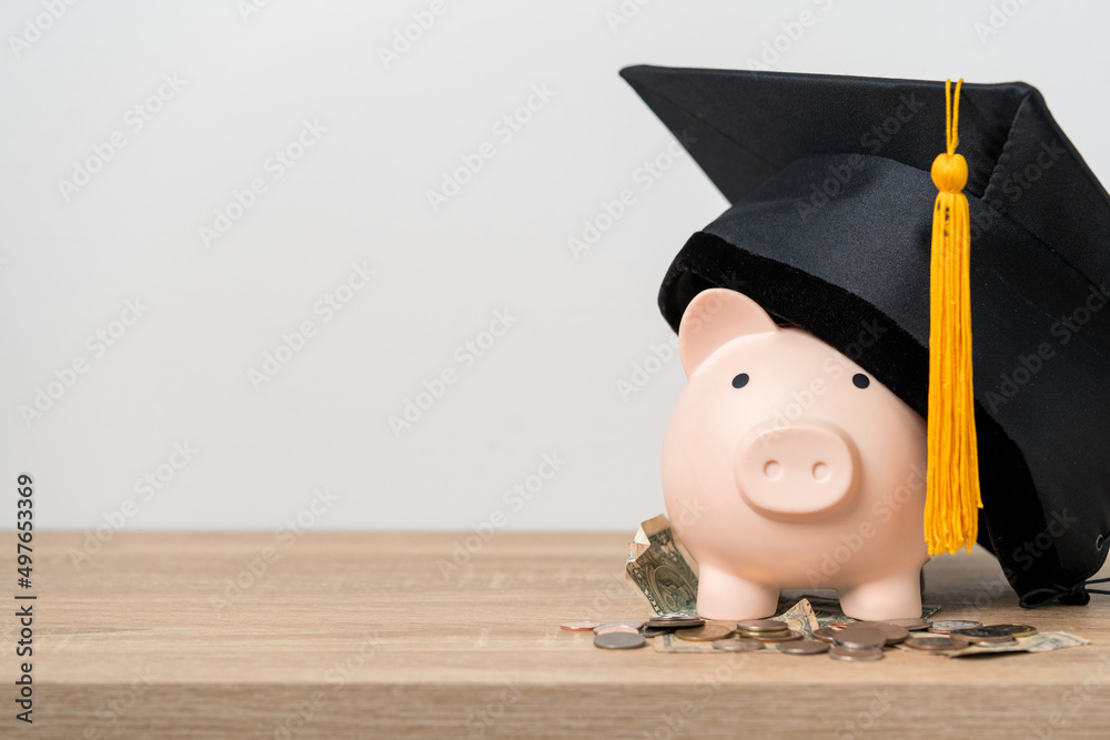 Black graduation hat and piggy bank concept investment in education ...