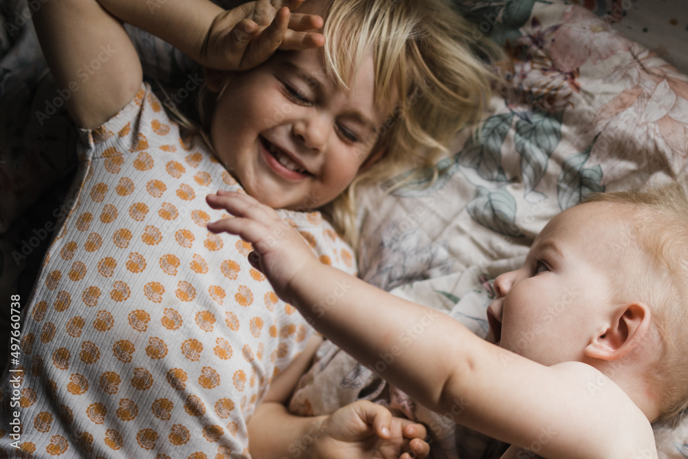 brother and sister tickling each other Stock Photo | Adobe Stock