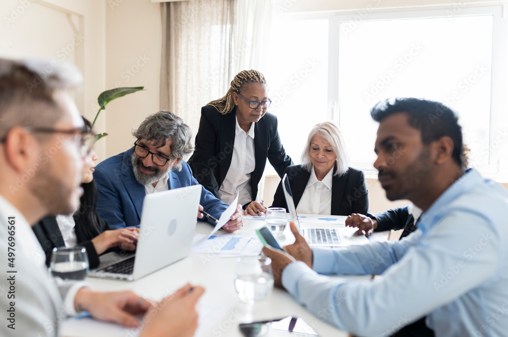 multiracial work group, people of different ages working together in ...