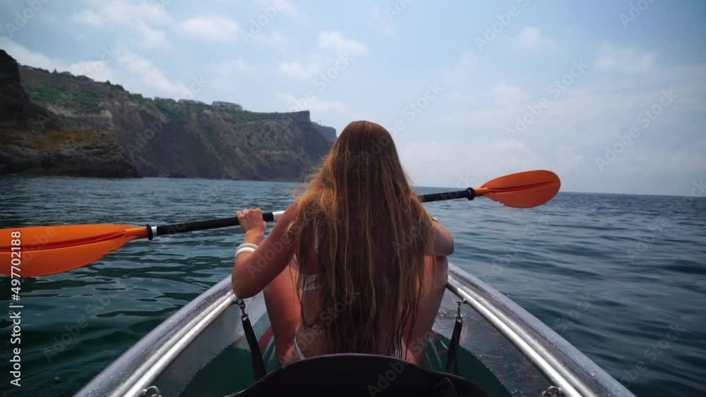 Young attractive brunette woman with long hair in white swimsuit ...
