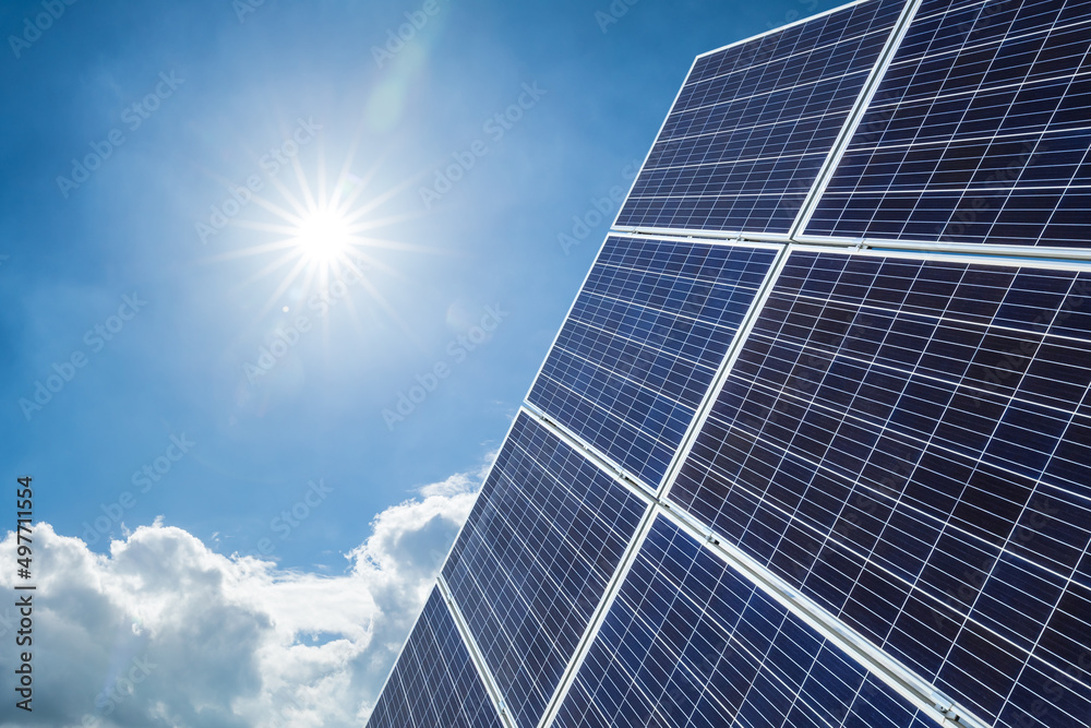 Solar panels and blue sky with sun. Renewable Energy Concept. Stock ...