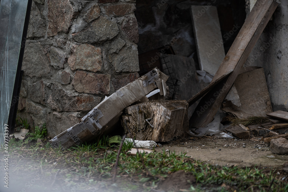 War in Ukraine. Damaged residential buildings. devastation in the yard ...