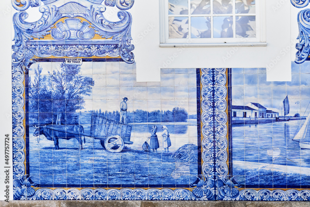 typical blue azulejos tiles which tells a story of life on the facade ...