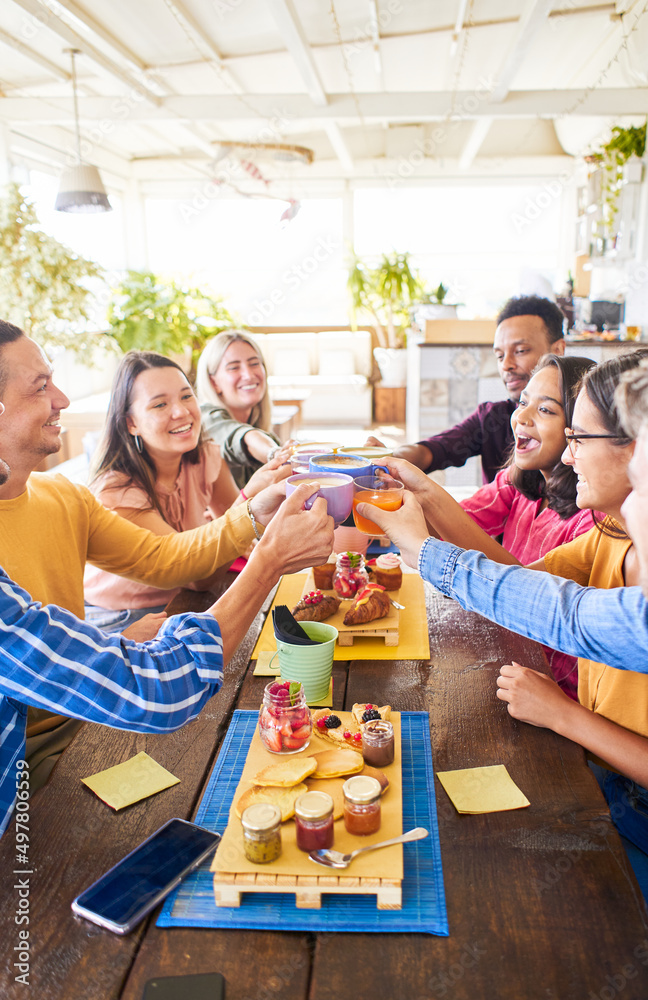 Vertical photo of Multicultural People having breakfast drinking coffee ...