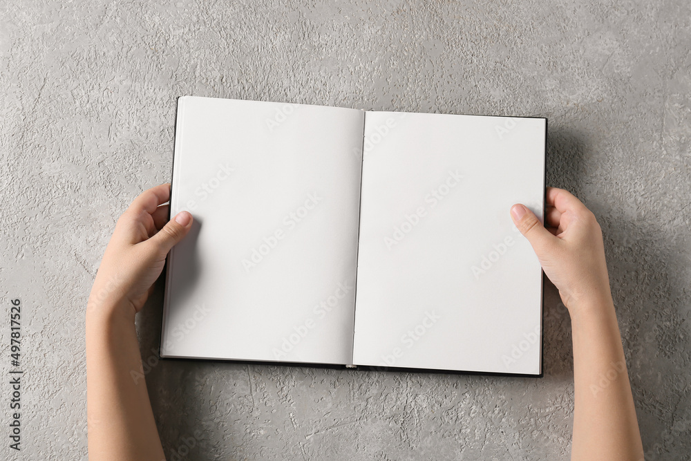 Child's hands with blank book on light background, closeup Stock Photo ...