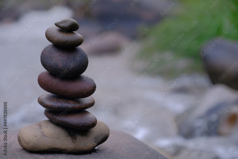 Zen stones are a symbol of balance. Stock Photo | Adobe Stock