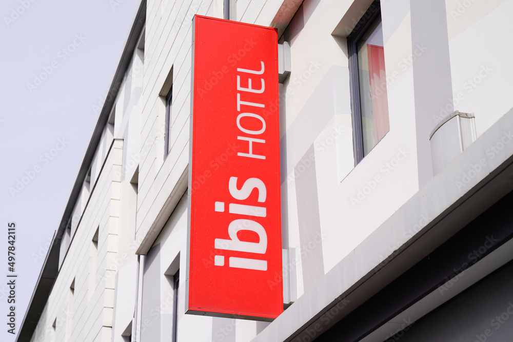 ibis hotel brand text and sign red logo on wall building facade Stock ...