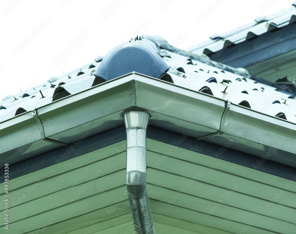 Roof corner of a house with gutter Stock Photo | Adobe Stock