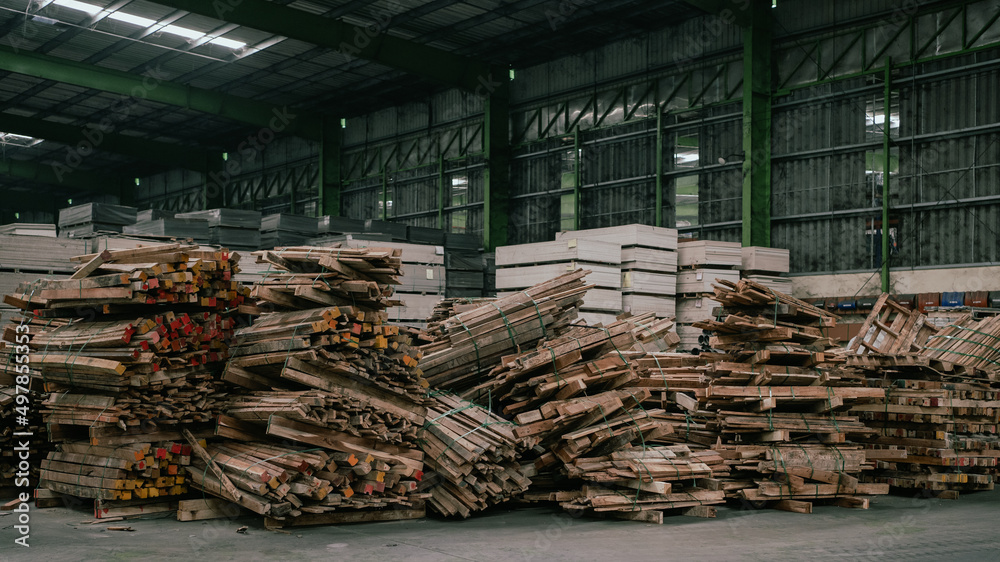 Massive piles of damaged wooden pallets awaiting disposal.Improper ...