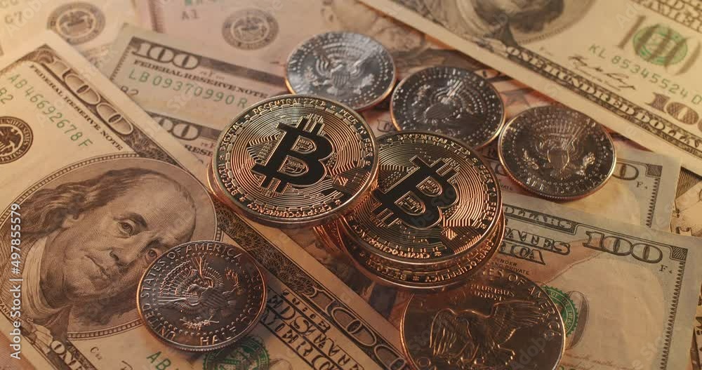 US Dollar and digital crypto currency Bitcoin. Gold and silver coins in ...