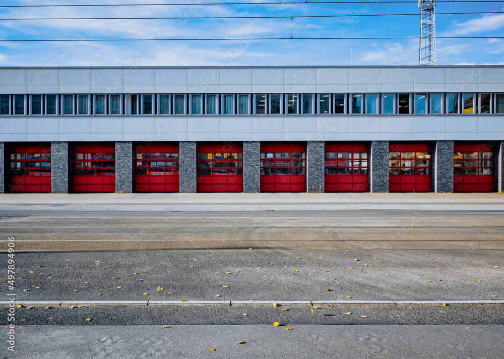 Fire station with red doors for the fire trucks. Stock Photo | Adobe Stock
