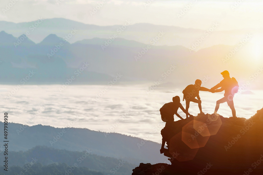 Climbing team are on the climb to the cliff,hiking and team work ...