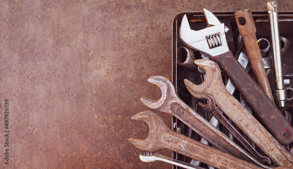 Old garage tool on rust metal background Stock Photo | Adobe Stock