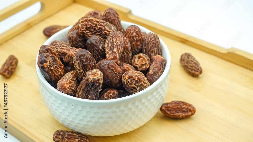 Dates also known as Khajur. Tasty dry dates isolated on white ...