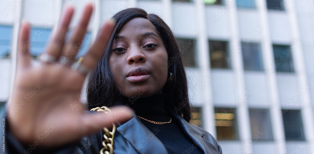 Confident black woman protesting against racial discrimination isolated ...