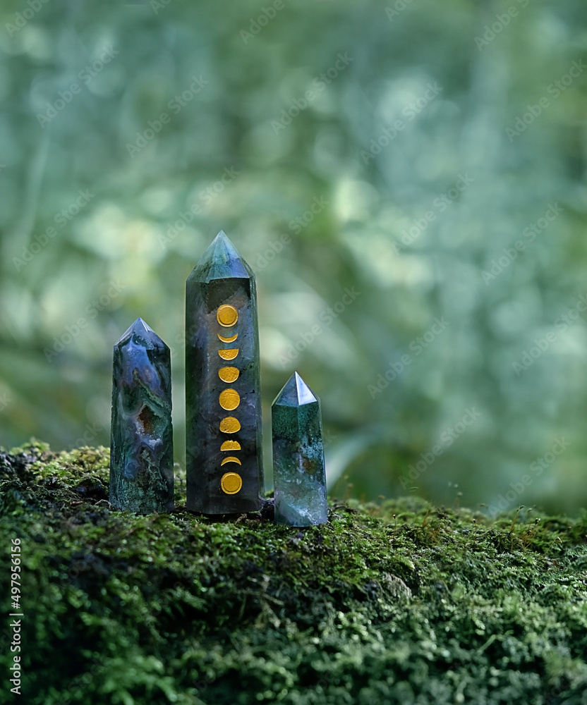Crystals with moon phases image on moss in mysterious forest, natural ...