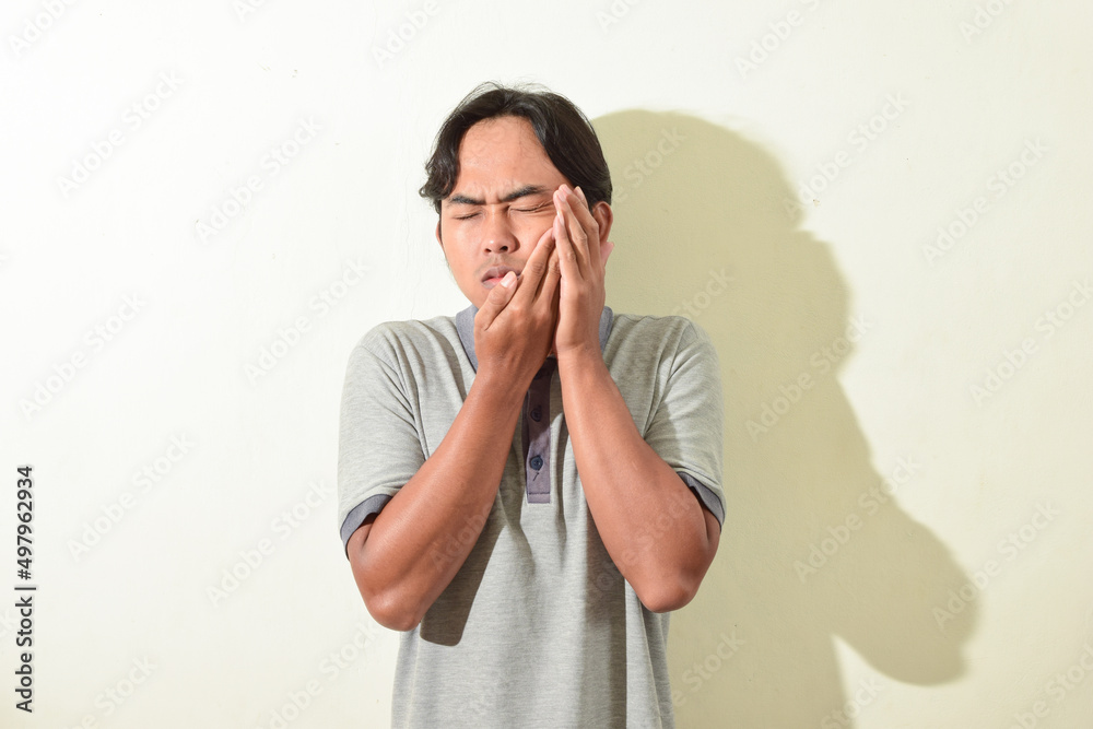 illustration of asian man having toothache. the pose of an Indonesian ...