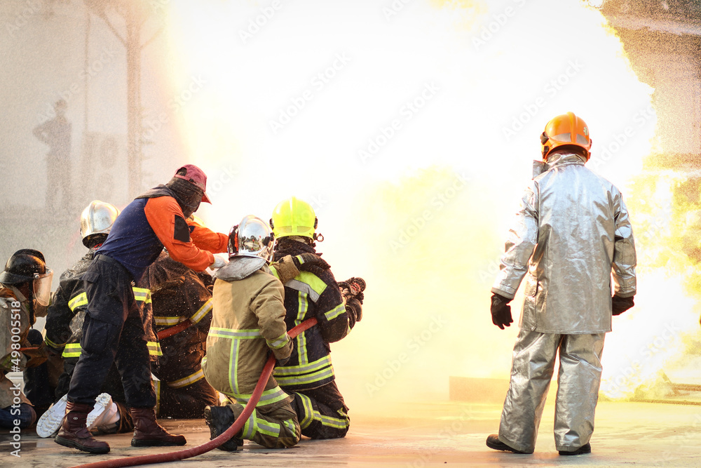 Firefighters using Twirl water fog type fire extinguisher to fighting ...