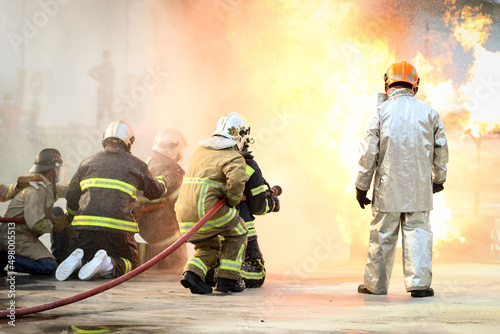 Firefighters using Twirl water fog type fire extinguisher to fighting ...