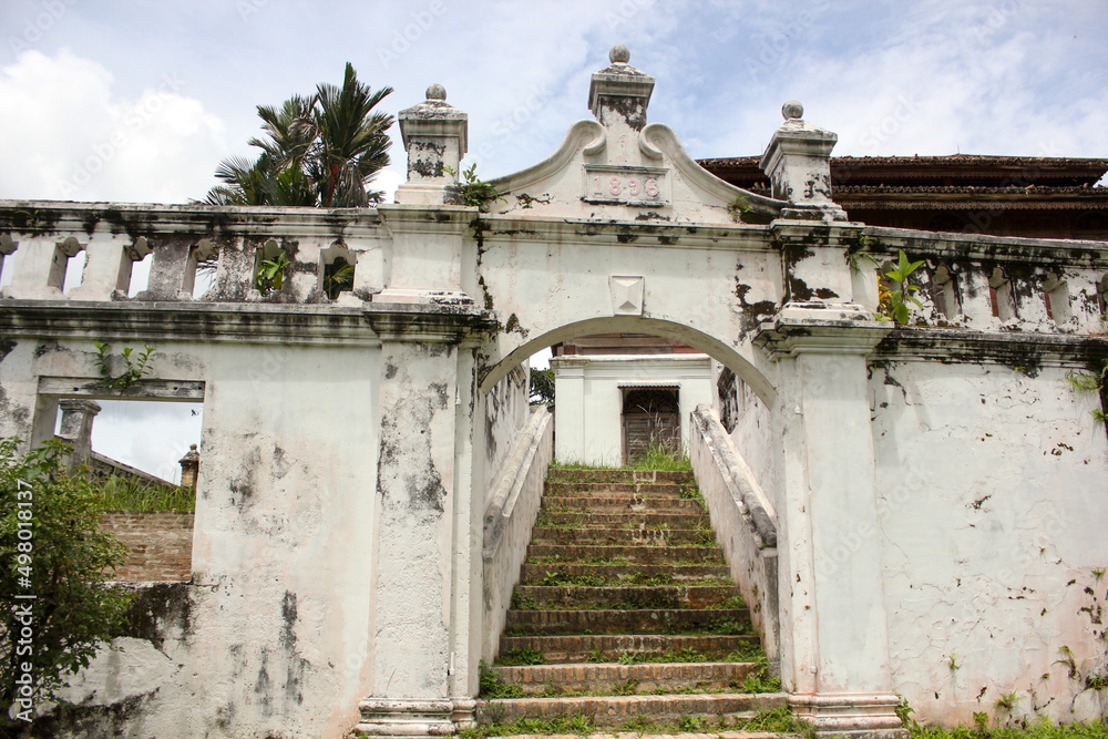 Exterior facade of an old, ruined building built in 1896 in the ...
