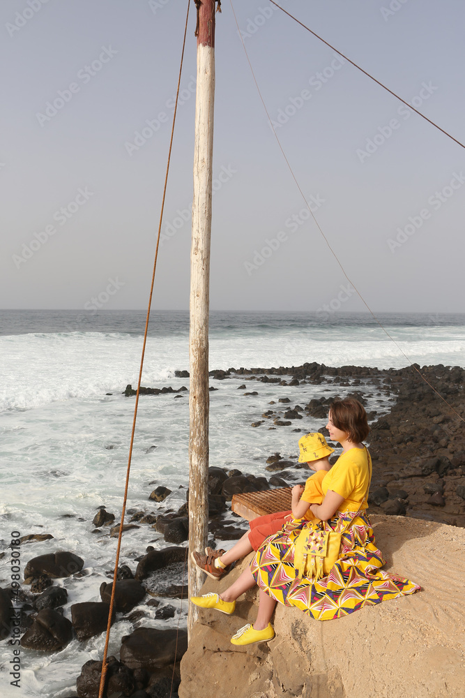 Tourist people, mother with son, woman and kid, child. Atlantic ocean ...