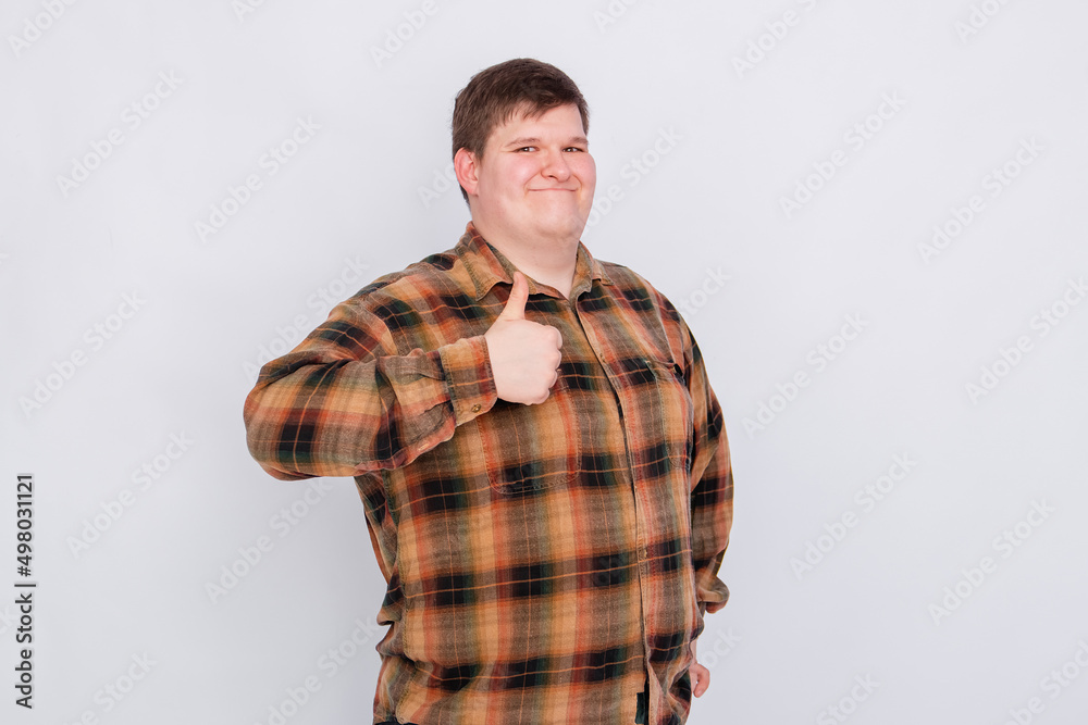 Fat guy showing thumb up isolated on white background. Young man making ...
