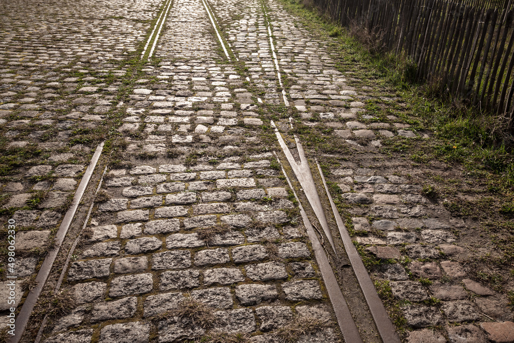 Abandoned rails in cobblestone on a former tram rail track railway ...
