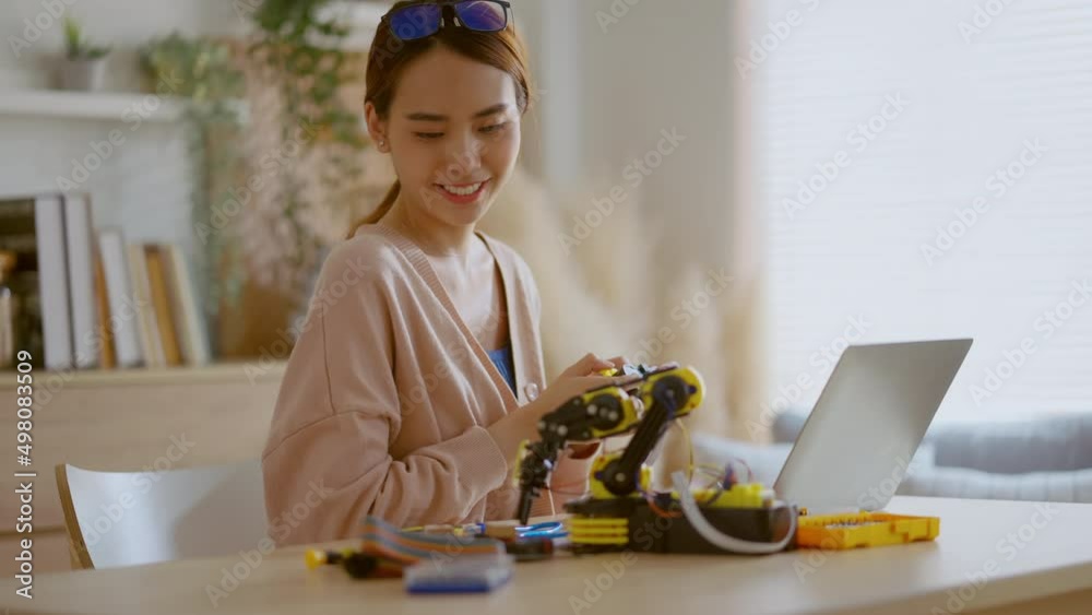 Smart Asian Female Programer Learning Robot Arm Ai Coding Electronic Board Cable In Stem Steam