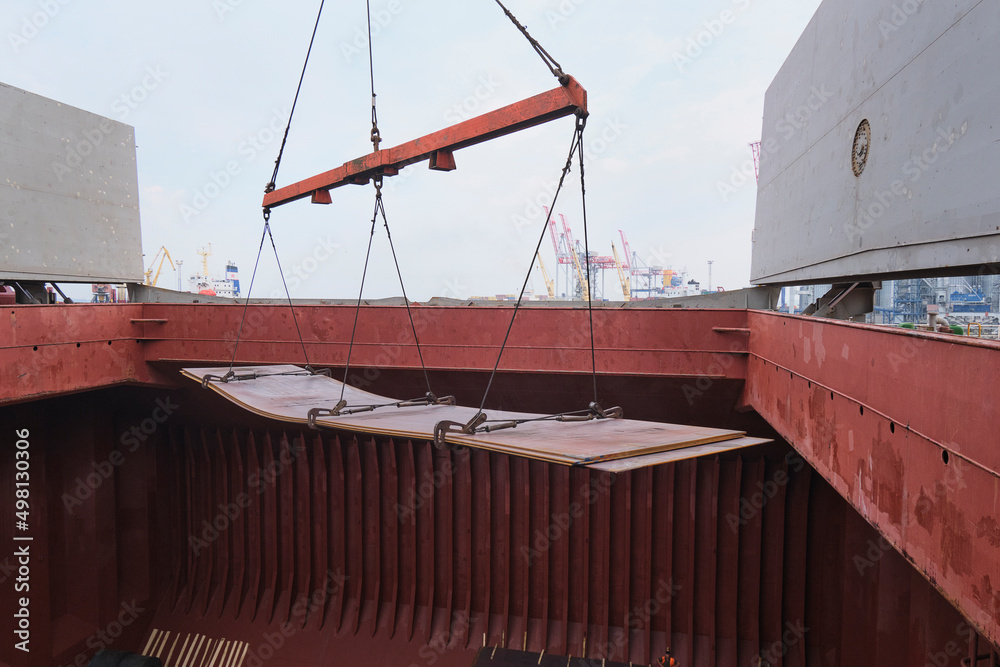 Loading of long hot rolled steel plates using spreader beam with steel ...