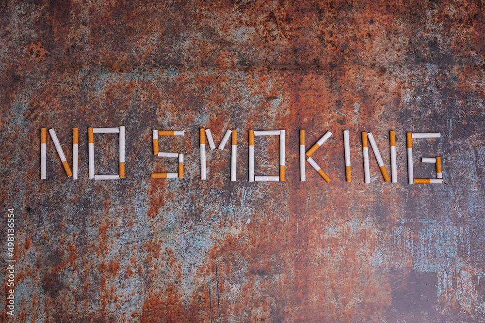 NO SMOKING lettering made with cigarettes on a rusty background - World ...
