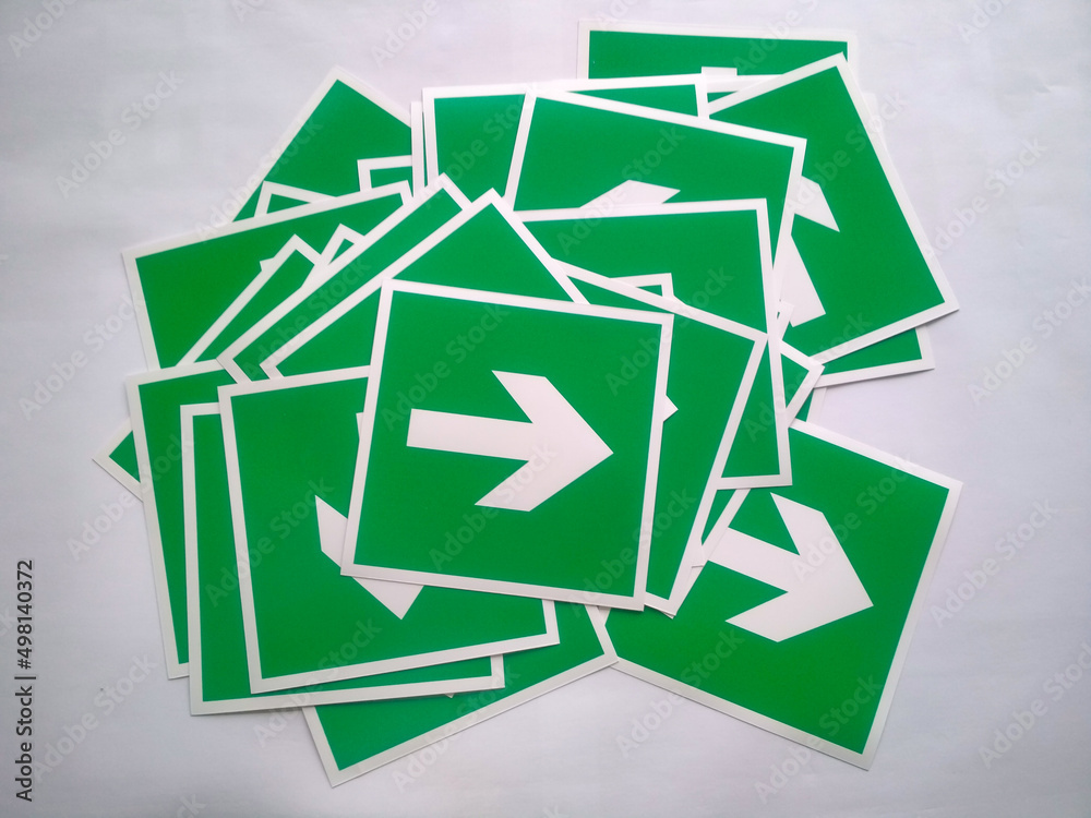 Fire exit sign or Sign fire escape. Pile of evacuation arrow stickers ...