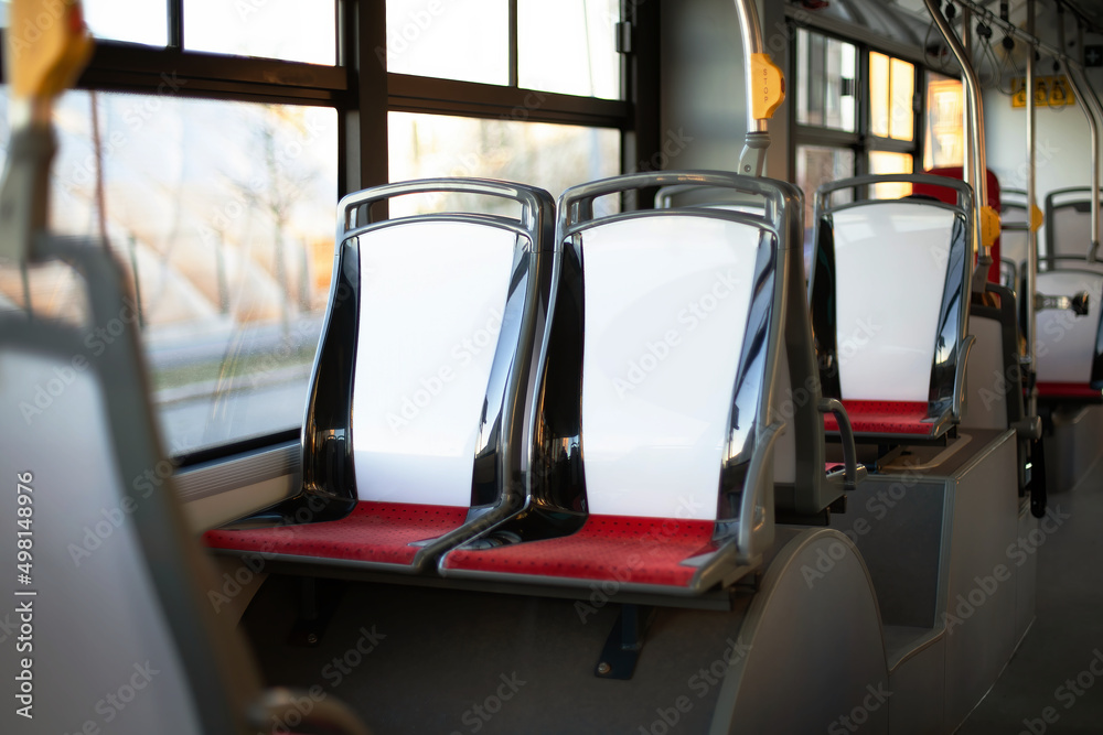 Seats in public transport. Modern city bus interior. Modern city bus ...