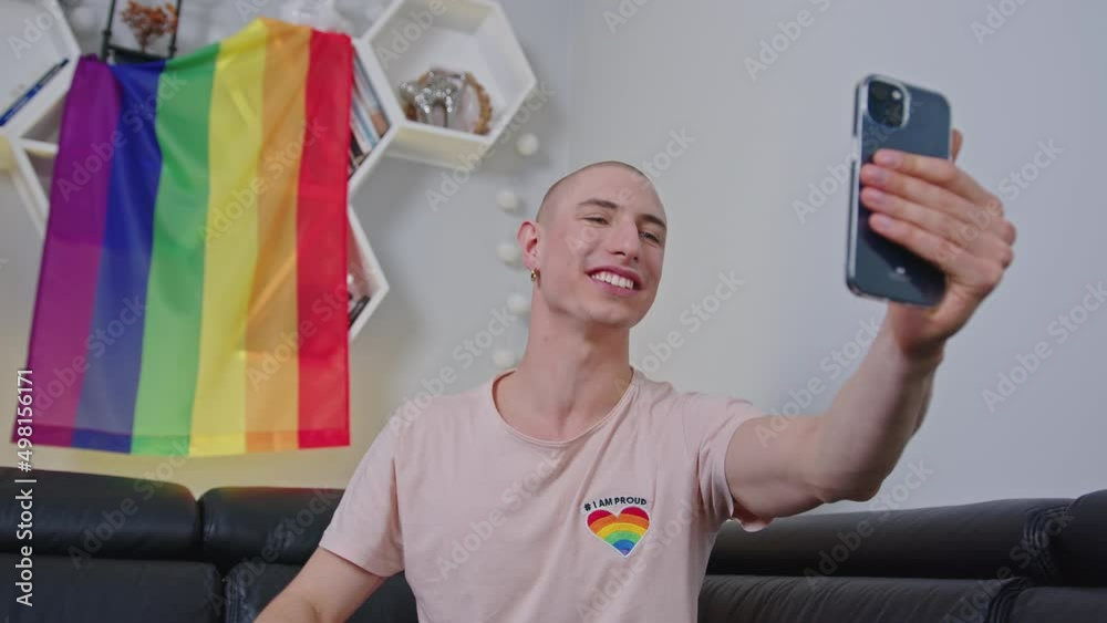 Queer non-binary bald influencer waves to his followers on social media ...