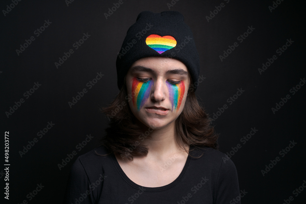 Crying eyes with rainbow iris flag on colored face concept sadness and ...
