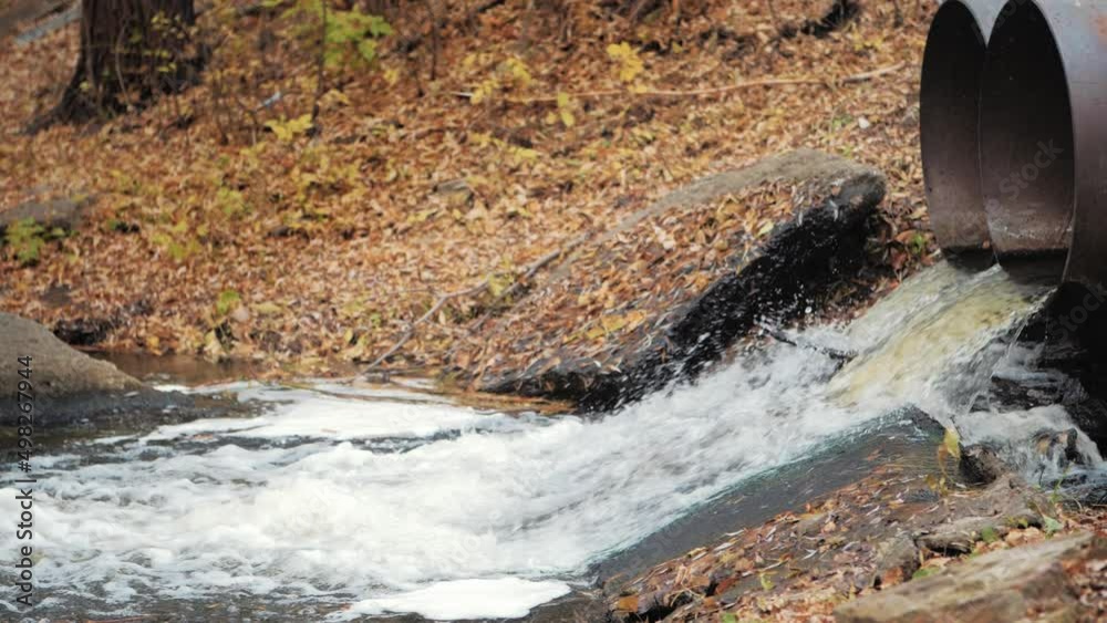 Environment protection concept. Industrial pipe discharging dirty waste ...