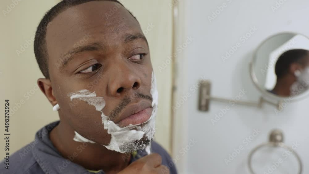 personal hygiene, African American or black man at home in bathroom ...