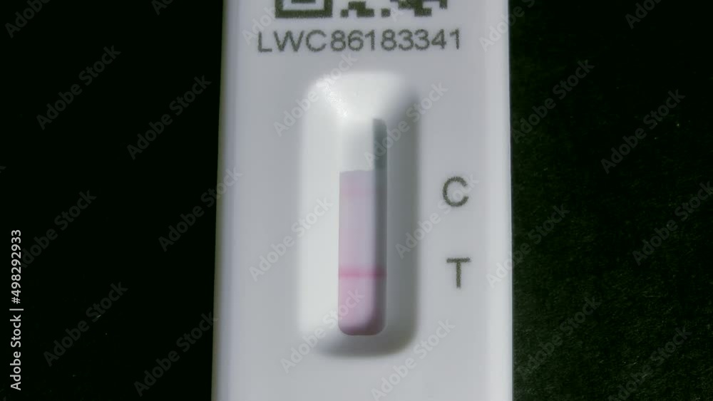 Coronavirus (COVID-19) rapid lateral flow test shows up a positive ...
