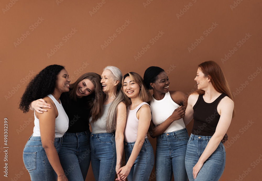 Six laughing women of different body types and ethnicities in studio ...